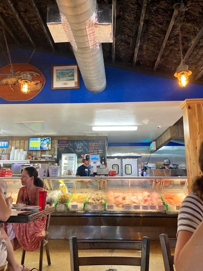The seafood counter showcases the day's catch, a glittering display of Gulf treasures waiting to become someone's perfect Florida meal memory.