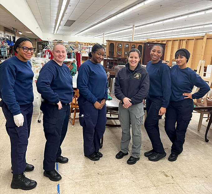 The dedicated team that keeps this thrifting paradise running smoothly. Their smiles are as genuine as the mission they support.