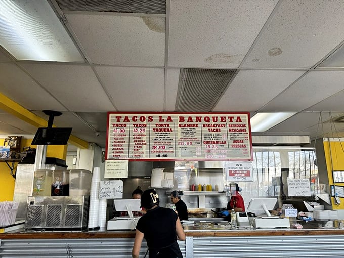 Where the magic happens &ndash; the open kitchen layout lets you witness the artistry behind each perfect taco. These aren't cooks; they're culinary conductors.