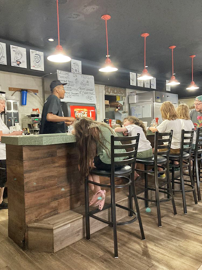 Where the magic happens&mdash;staff working behind the counter with the focused precision of people who take your breakfast satisfaction very seriously.