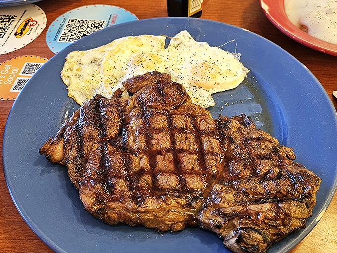 This steak doesn't need a white tablecloth to impress—just eggs, a hot grill, and a kitchen that understands breakfast is serious business.