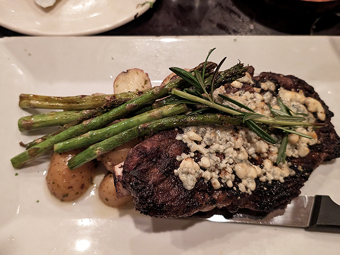 A steak topped with blue cheese and accompanied by asparagus&mdash;proof that sometimes the simplest combinations are culinary poetry.