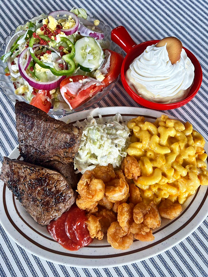 The surf meets turf in this glorious alliance of land and sea. With mac and cheese playing diplomat between warring protein factions.