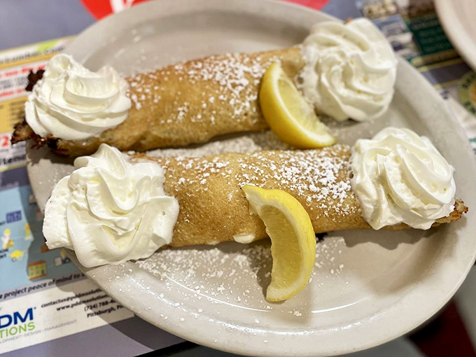 Swedish blintzes topped with whipped cream clouds and lemon sunshine. Breakfast becomes dessert, and nobody's complaining.
