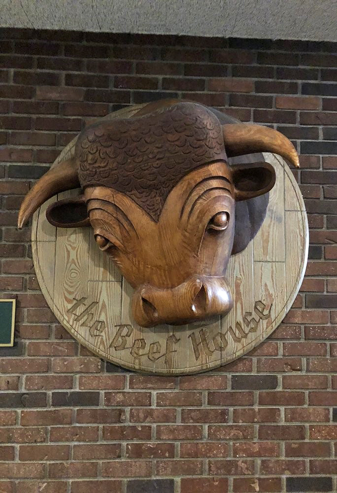 The wooden bull emblem stands as a proud sentinel of quality. This carved mascot has witnessed generations of dining memories.