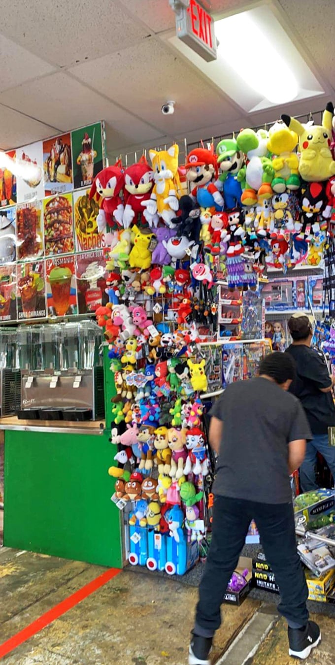 Nostalgia overload! Gaming characters dangle in plush form, creating a colorful wall of childhood memories for shoppers of all ages.