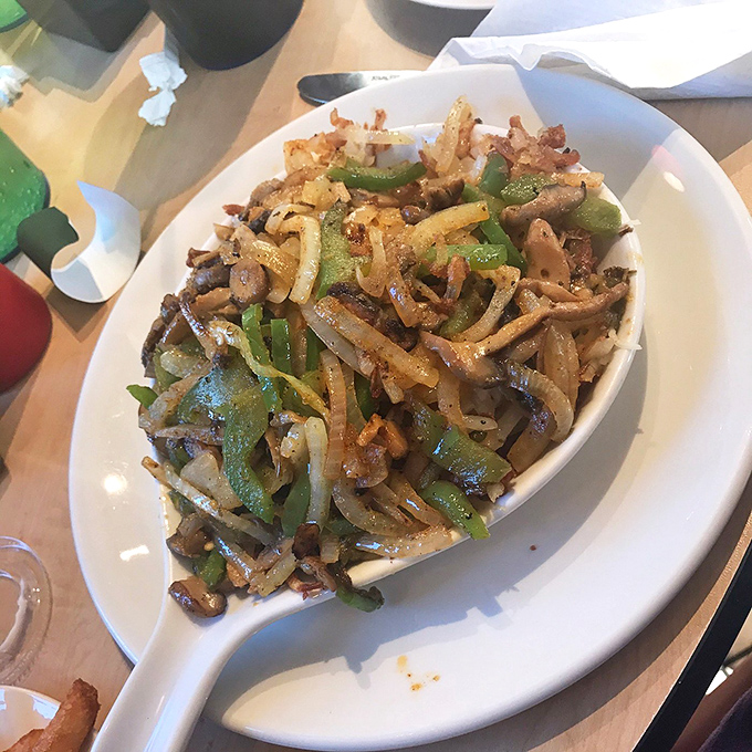 A skillet loaded with enough vegetables and savory goodness to make you temporarily forget about that tenderloin sandwich. Almost.