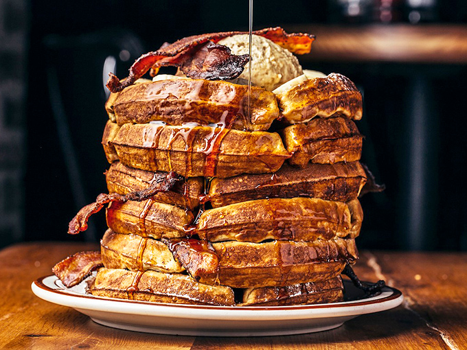 This tower of waffles and bacon isn't breakfast—it's an edible skyscraper of morning joy. Maple syrup waterfall included.