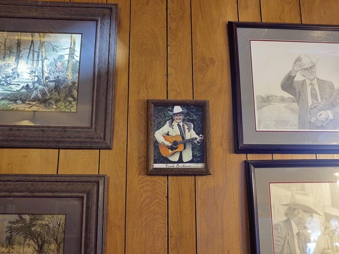 The wall art gallery curated with the precision of the Louvre, if the Louvre specialized in local memorabilia and country music legends.
