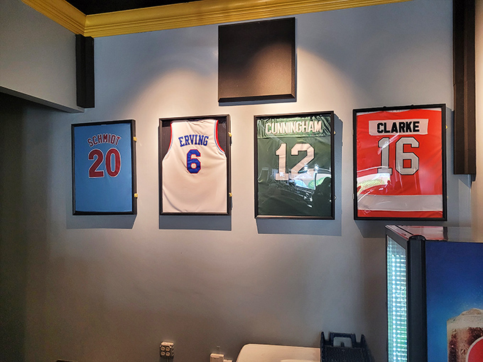 A wall of sports history that says "you're among friends." These framed jerseys create the perfect backdrop for passionate debates over wiz versus provolone.