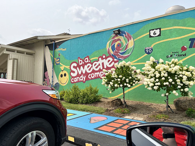 The exterior mural serves as a colorful roadmap to sweetness. Follow the lollipop road to your sugar destination.