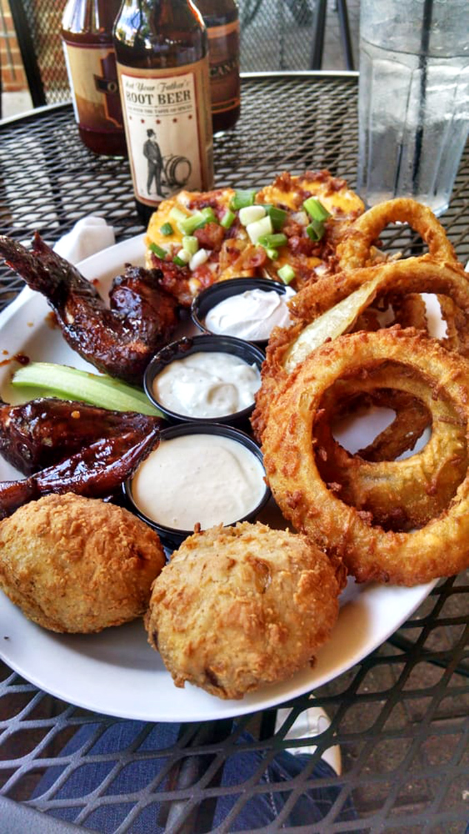 A platter of pure joy featuring crispy wings, golden onion rings, and hushpuppies&mdash;proof that sometimes more really is more.