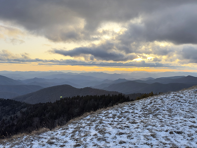 Winter's first dusting creates a two-tone world where mountains fade into misty horizons, proving Mother Nature needs no filter.