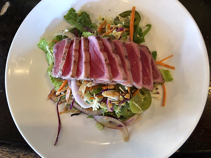 Perfectly seared ahi tuna, ruby-red center gleaming like jewels atop a vibrant salad&mdash;proof that healthy eating needn't sacrifice an ounce of pleasure.