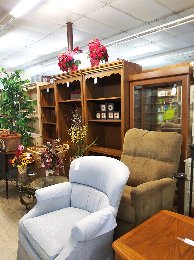 A powder blue armchair sits patiently, dreaming of its next life as someone's favorite reading nook or the perfect spot for morning coffee.