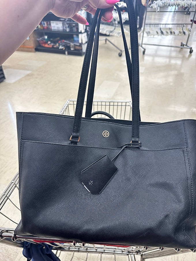 That's not just any black tote &ndash; it's a designer bag that somehow landed in thrift store territory. The thrill of the find is sweeter than the savings.