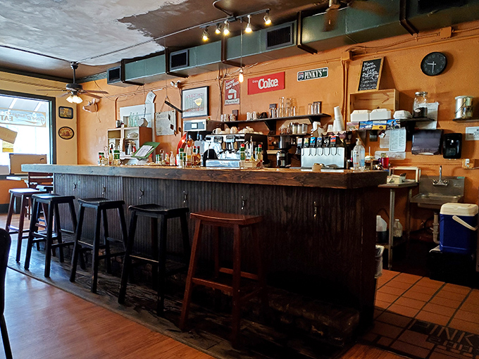 The bar area&mdash;where coffee mugs are filled with the urgency of firefighters responding to an alarm. Morning salvation, one cup at a time.