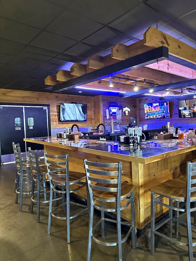 The bar area strikes that perfect balance between "watching the game" and "having a conversation"&mdash;with wood and metal creating a modern rustic vibe.