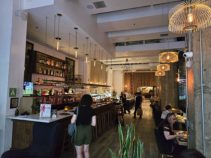 Where liquid happiness meets culinary magic. The sleek bar area promises creative libations to complement your carnivorous adventure.