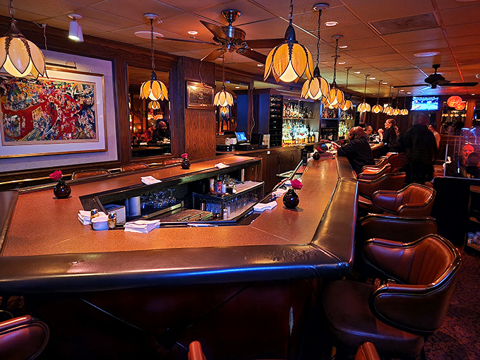 The bar counter gleams with promise, each bottle backlit like performers waiting for their moment in your evening's flavor story.