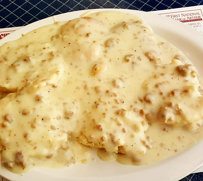 Biscuits and gravy performing their timeless duet&mdash;the fluffy base nearly obscured by a cream-colored cascade of peppery comfort.