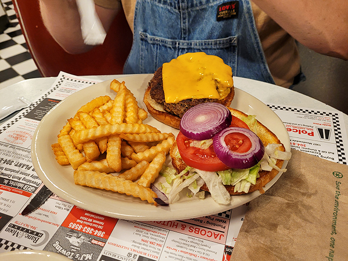 A burger that understands its purpose in life&mdash;to deliver perfect beef-to-cheese ratio on a toasted bun with crispy fries standing guard on the side.