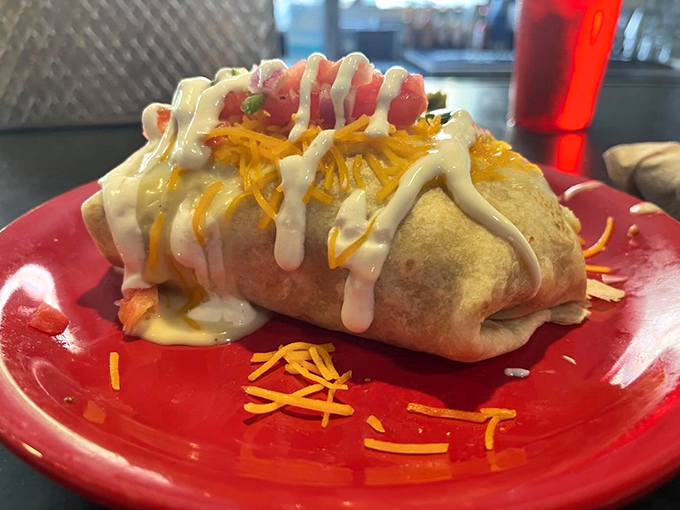 This isn't just a burrito&mdash;it's breakfast wrapped in a warm hug, then smothered with cheese and sauce. Morning comfort food that requires both hands and zero shame.