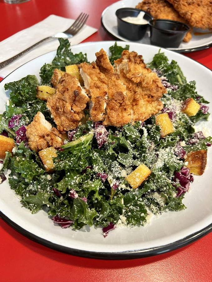 Even the salads here mean business—crisp kale, crunchy croutons, and fried chicken proving that "healthy choice" doesn't mean "boring choice."