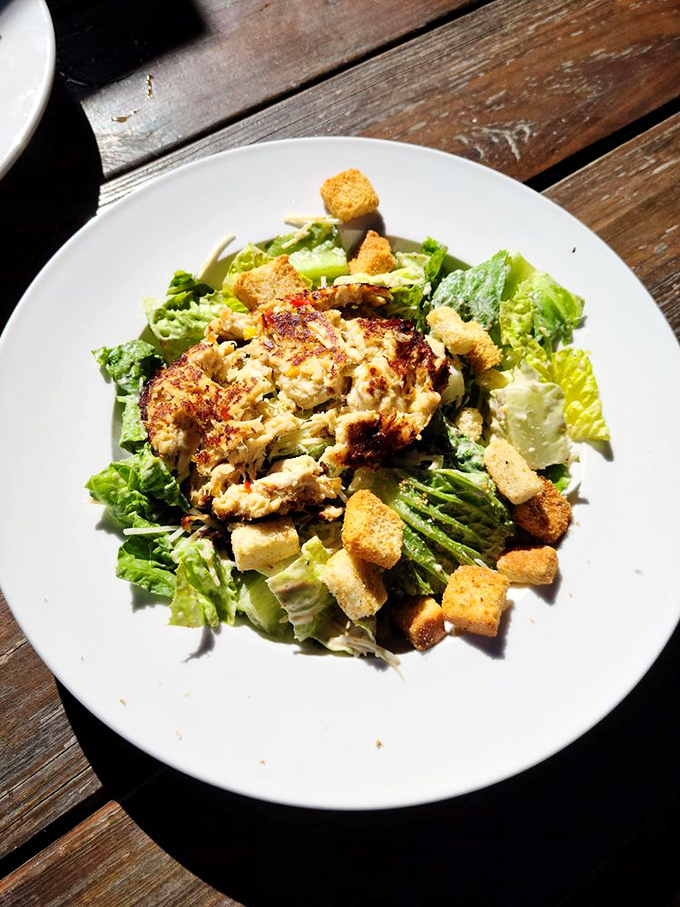 Caesar salad gets the royal treatment with perfectly seasoned greens and croutons that actually matter for once.