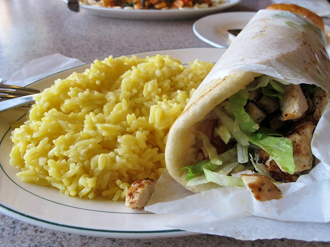 The chicken gyro wrap&mdash;proof that good things come in cylindrical packages. That yellow rice isn't just a side; it's essential for soaking up every last bit of flavor.