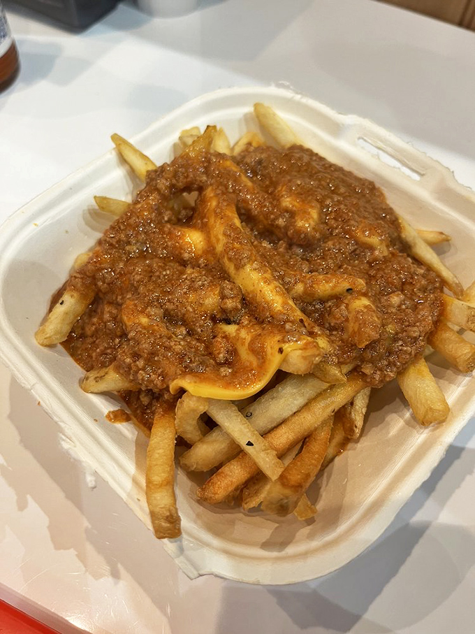 Chili cheese fries&mdash;where the humble potato transcends into a gooey, meaty masterpiece that requires both fork and determination.