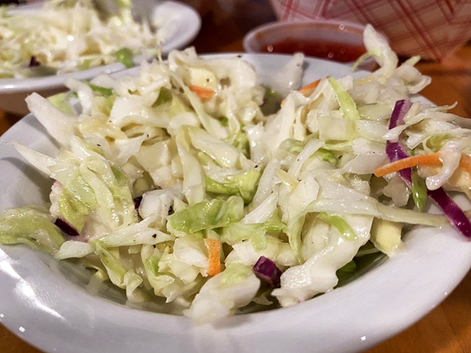 The coleslaw provides a crisp, refreshing counterpoint to all that glorious fried goodness &ndash; like a palate-cleansing intermission between acts.
