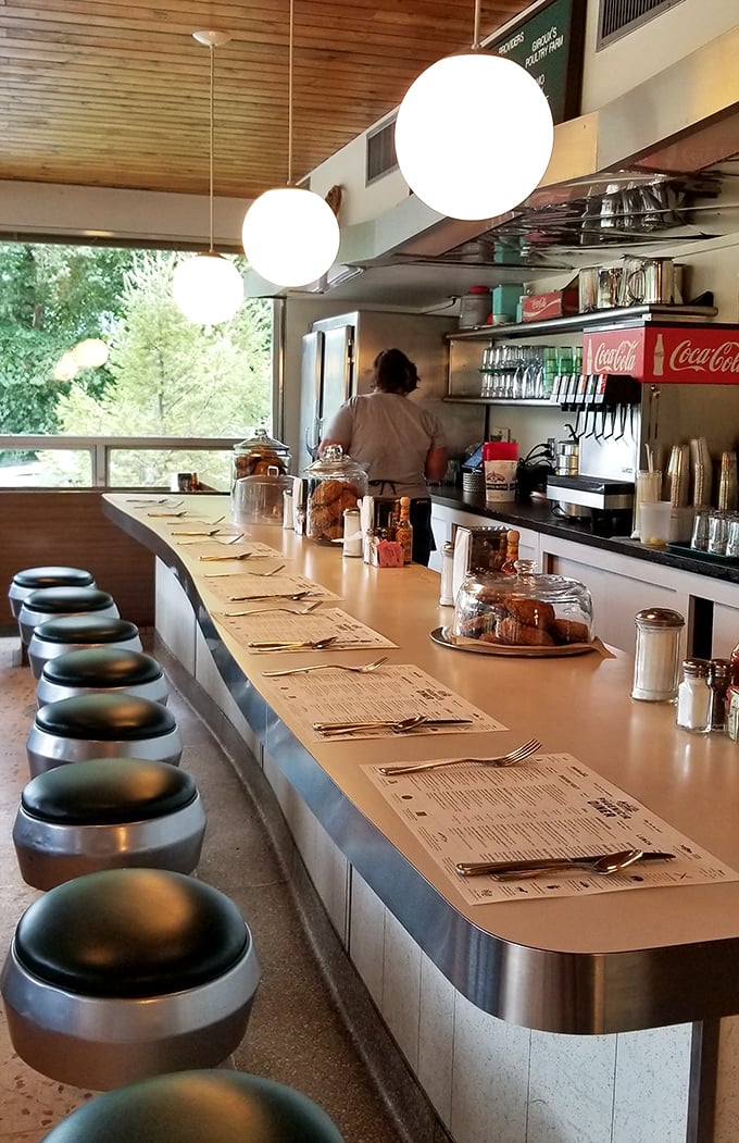 The counter&mdash;where solo diners become food critics and the staff becomes family. Every stool has witnessed at least one life-changing decision.