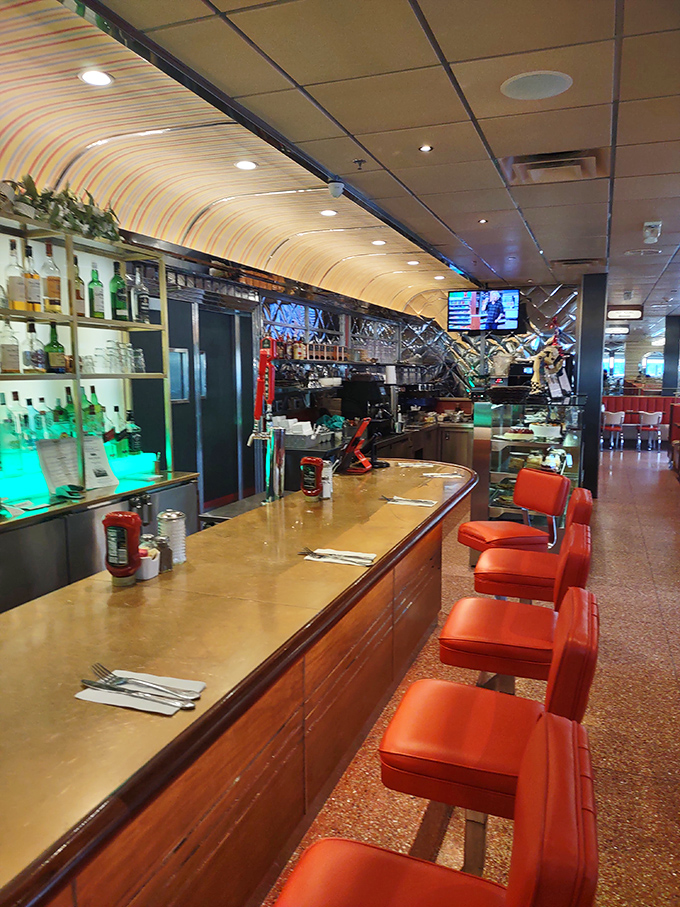 The counter&mdash;where solo diners become temporary family, watching the short-order ballet while perched on those signature red vinyl stools.