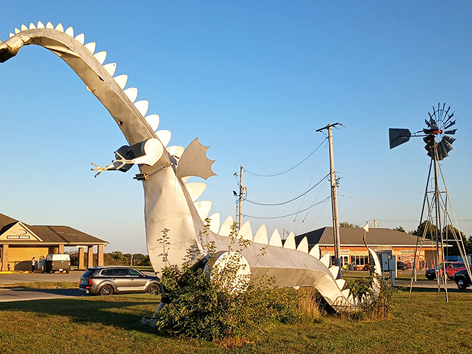 Against a brilliant blue Illinois sky, the dragon unleashes its fiery breath while a visitor watches from a safe distance.