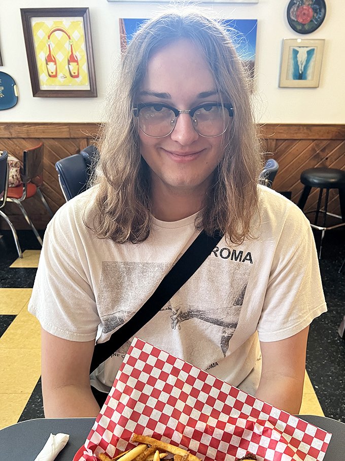 Colorful stained glass panels let in dancing light, creating the perfect ambiance for pancake appreciation and coffee contemplation.