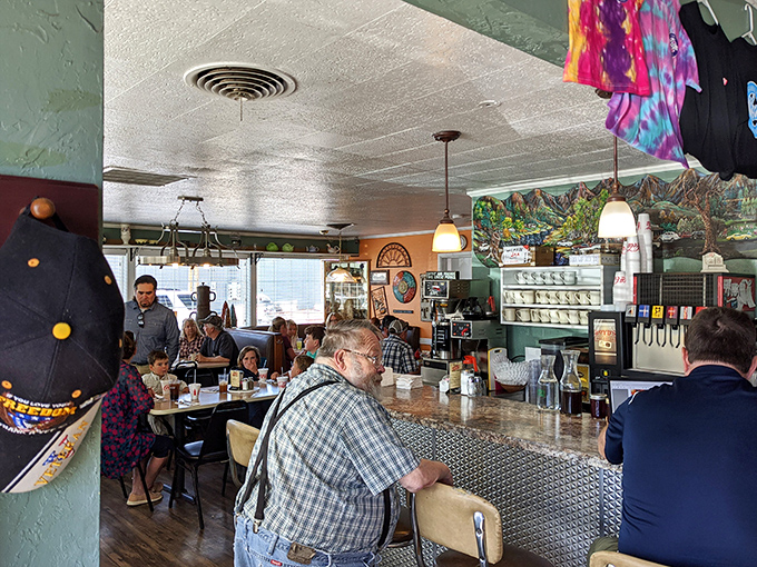 The morning symphony in full swing—coffee cups conducting, regulars in their assigned seats, and breakfast aromas writing the day's first chapter.
