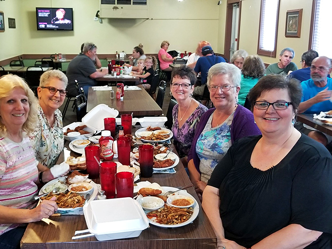 Where strangers become friends over shared plates of legendary chicken&mdash;a community built one crispy bite at a time.