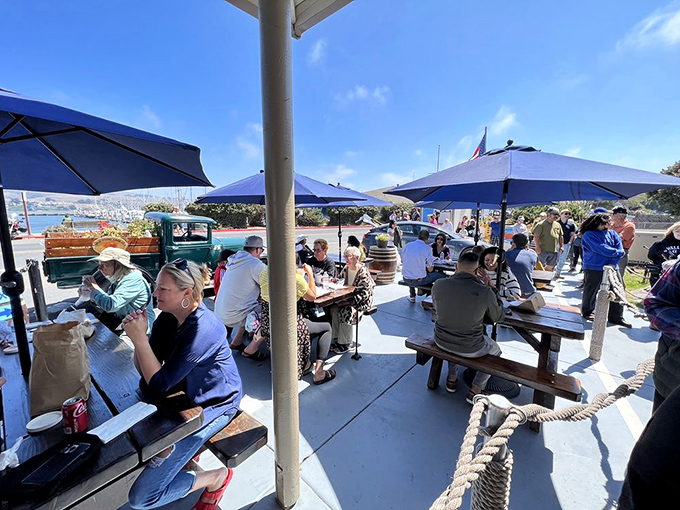 The outdoor dining scene&mdash;where strangers become friends over shared chowder enthusiasm. Ocean views included at no extra charge.