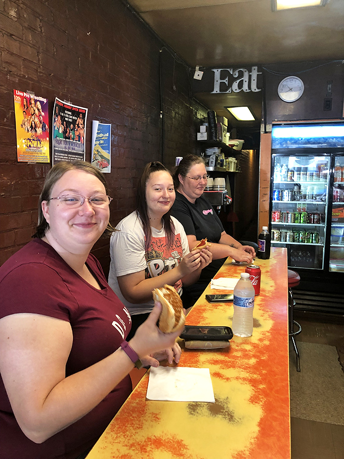 The true heart of any great eatery: the people who make it happen. These smiling faces are the keepers of the Squeeze-In legacy.