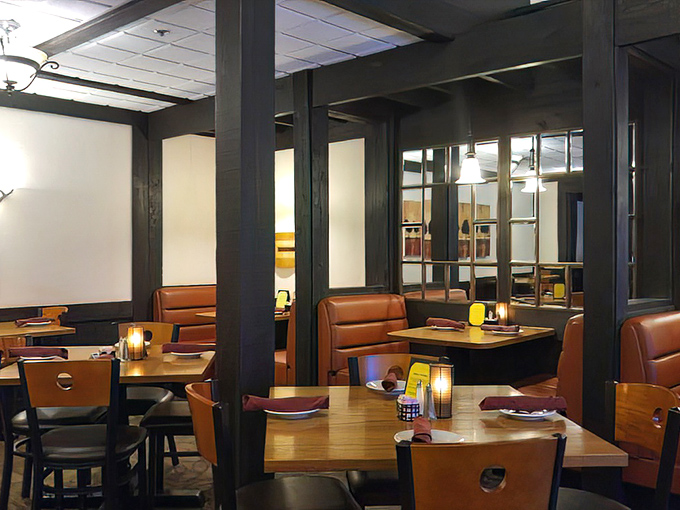 Cozy booths and warm lighting create the perfect backdrop for important life decisions&mdash;like whether to order dessert after demolishing a 16-ounce steak.