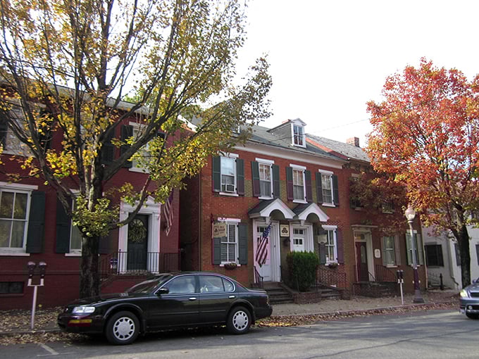 Autumn paints these historic brick homes in patriotic splendor, their well-maintained facades a testament to Lititz's dedication to preserving its architectural heritage.