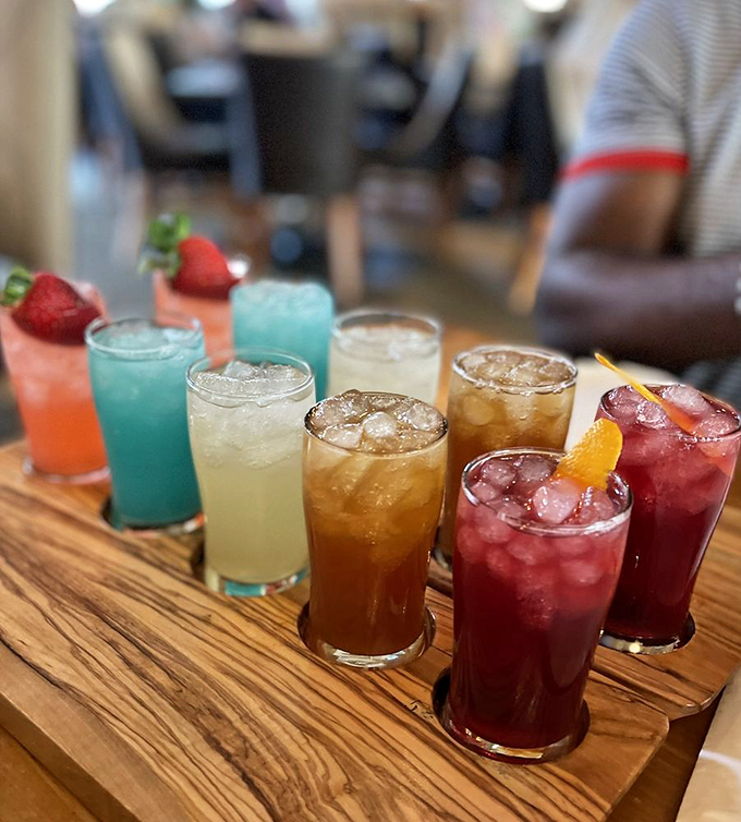 A rainbow of refreshing cocktails lined up like Florida sunsets in a glass. Each one promising a different kind of vacation in every sip.