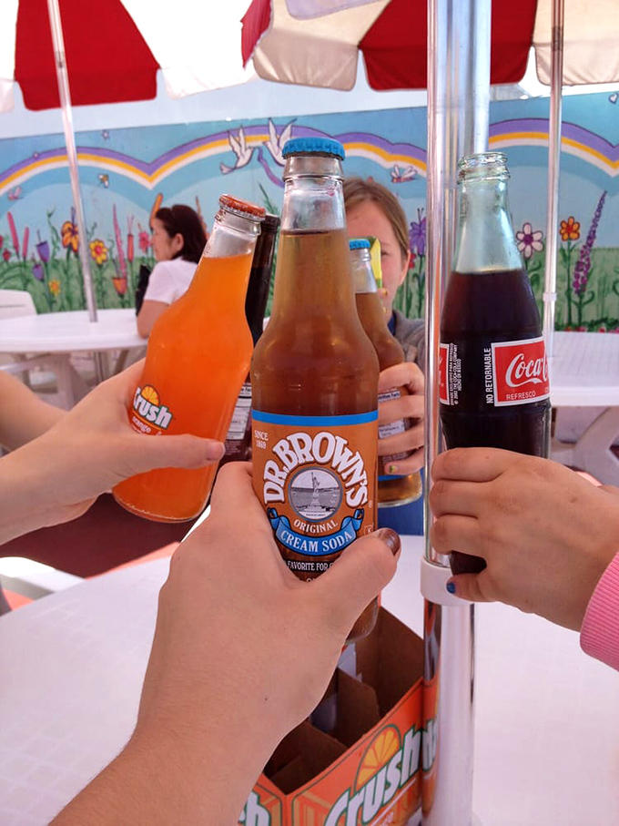 Classic sodas in glass bottles because some traditions deserve respect, especially when paired with legendary hot dogs.