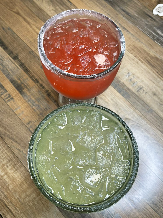 Margaritas with salt-rimmed perfection: one red, one green, both delicious. These aren't just drinks; they're liquid sunshine in a glass, Iowa-style.