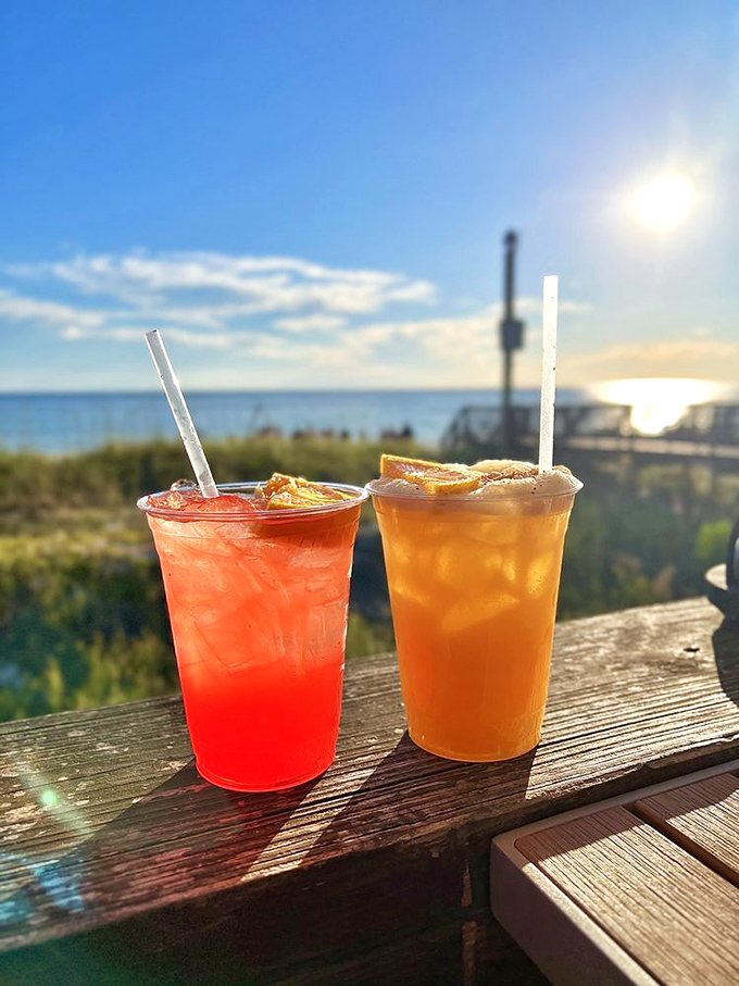 Colorful cocktails against the Gulf backdrop&mdash;liquid sunshine that tastes even better than it looks, especially during that golden hour glow.