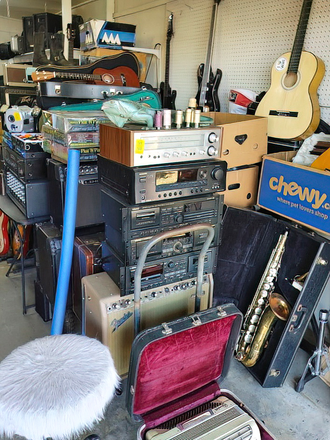 Vintage audio equipment stacked like a time machine through decades of music technology. From cassette decks to saxophones, yesterday's sounds await tomorrow's musicians.