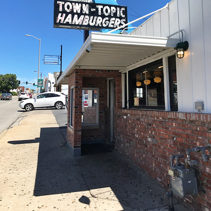 The unassuming entrance doesn't prepare you for the flavor explosion waiting inside&mdash;like finding a portal to burger paradise on an ordinary street.