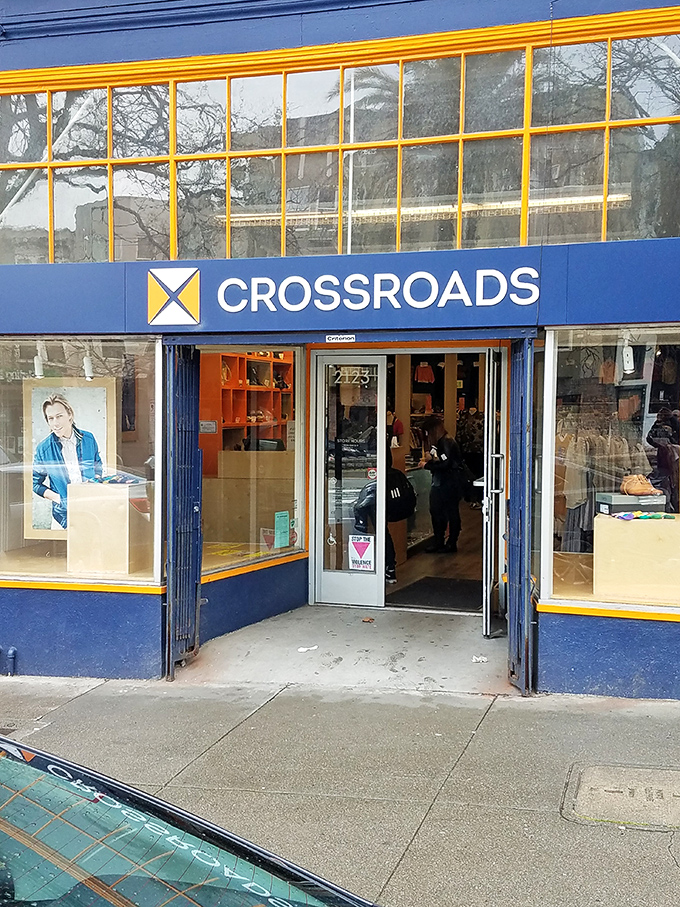 The welcoming entrance to fashion paradise. Crossroads' bright blue exterior with signature yellow trim invites bargain hunters to step inside.