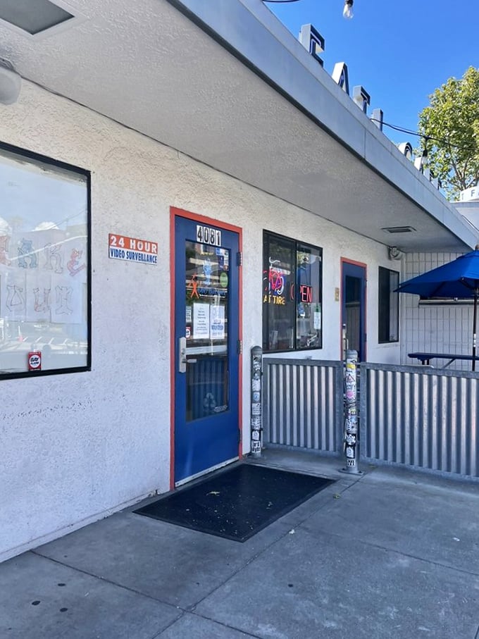 The blue door entrance stands like a portal to breakfast nirvana &ndash; simple, unassuming, yet promising culinary delights that keep locals coming back.